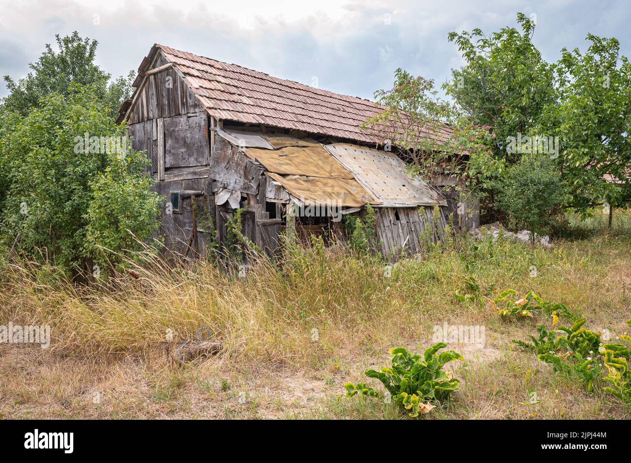 Abandoned country house is falling apart Stock Photo - Alamy