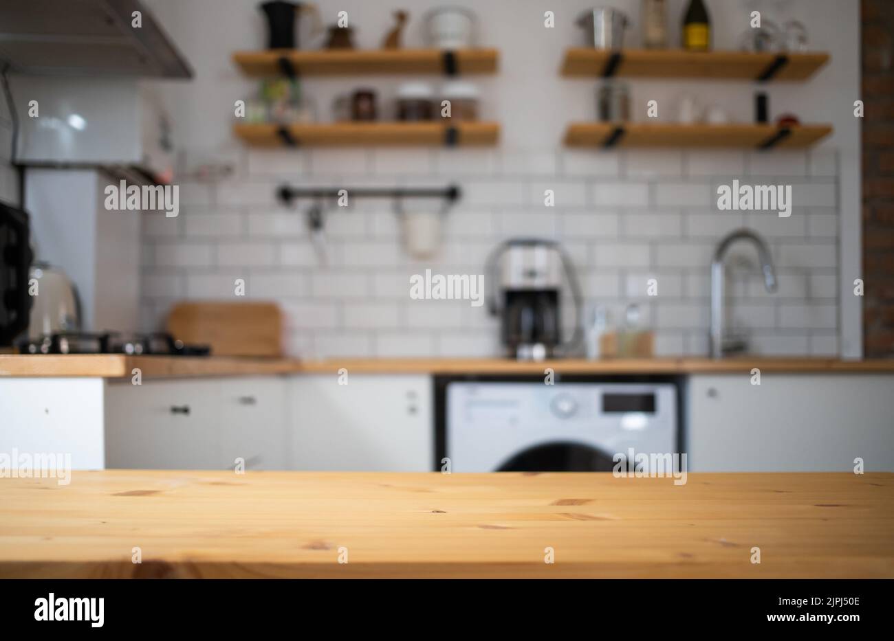 empty wooden tabletop and blurred kitchen mock up for product display ...