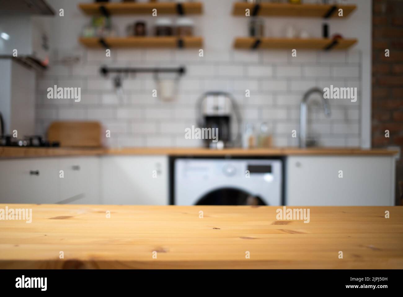 empty wooden tabletop and blurred kitchen mock up for product display ...