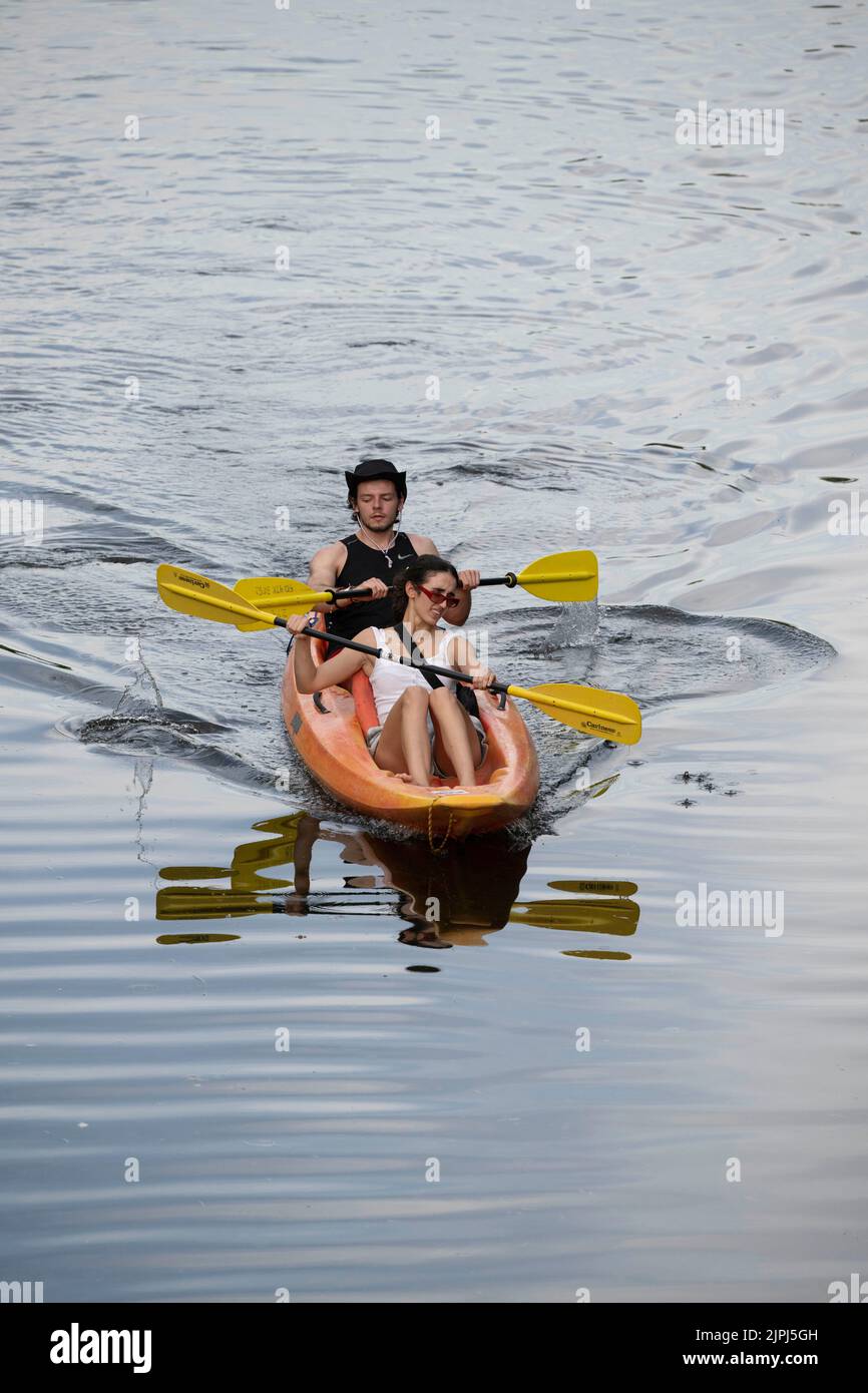 Austin Texas USA, August 14, 2022: Two people paddling in a kayak enjoy ...