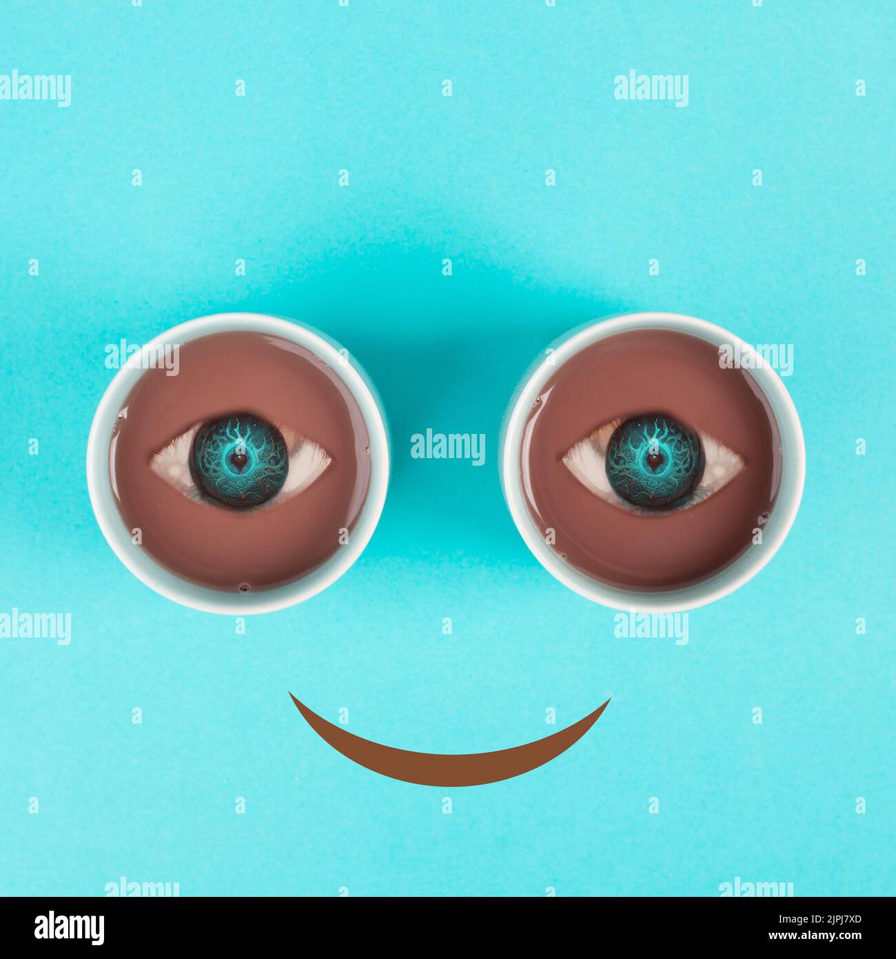 Cup of coffee building the eyes of the funny face, mouth is smiling ...