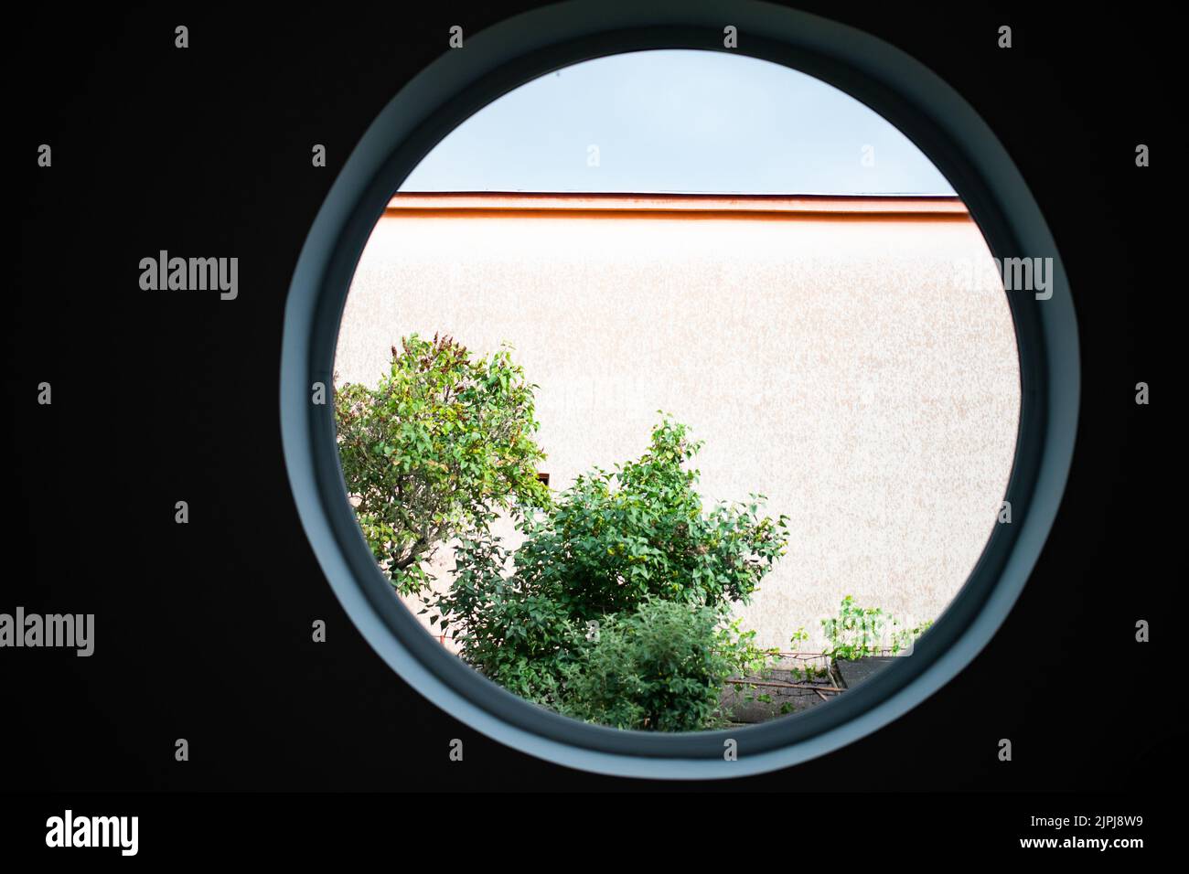 round window tree and house Stock Photo - Alamy