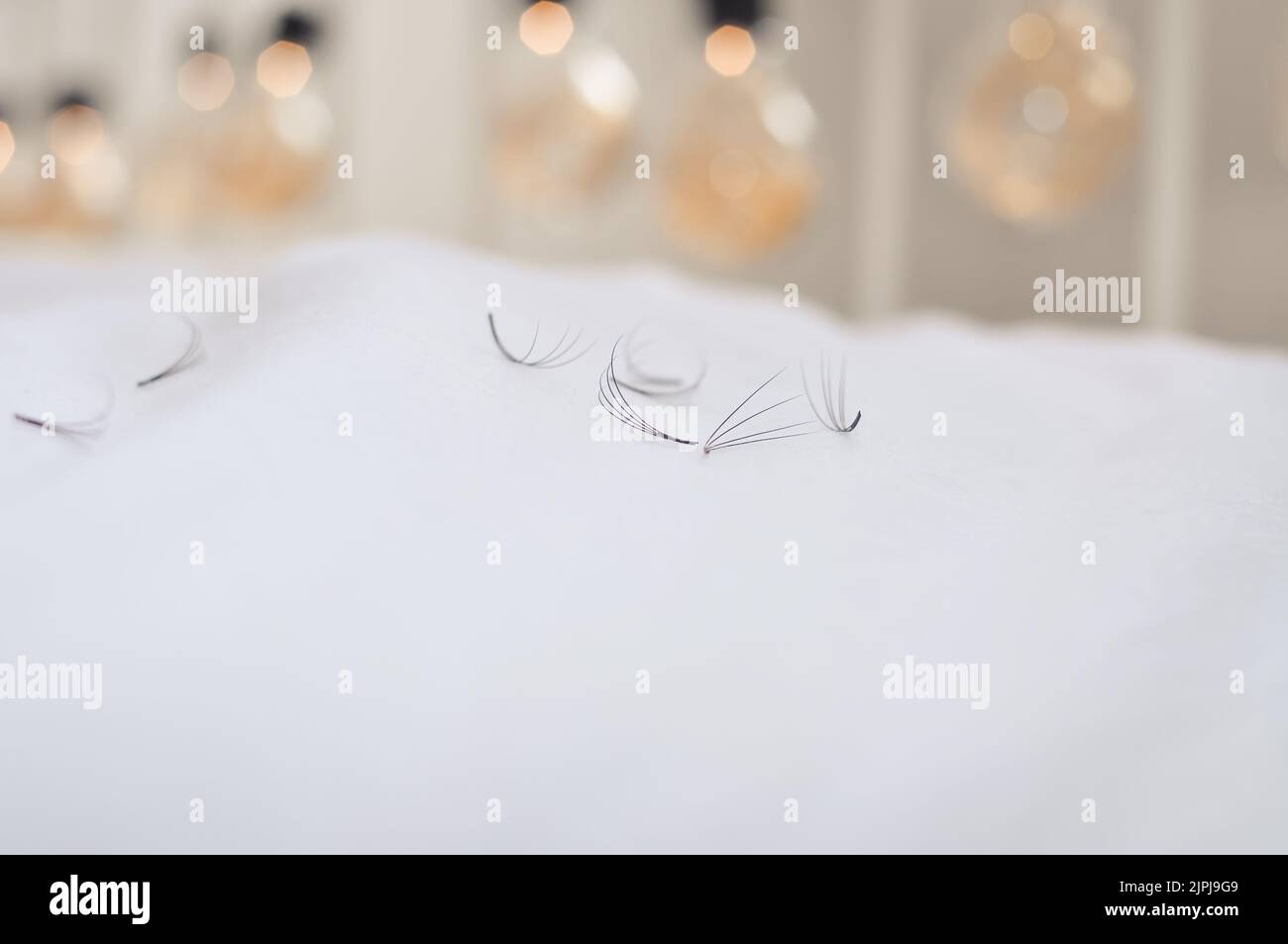 Bunches of fake lashes fell down after eyelash extensions, beauty salon ...