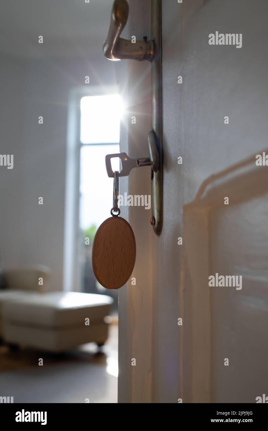key opening white door to a modern home Stock Photo - Alamy