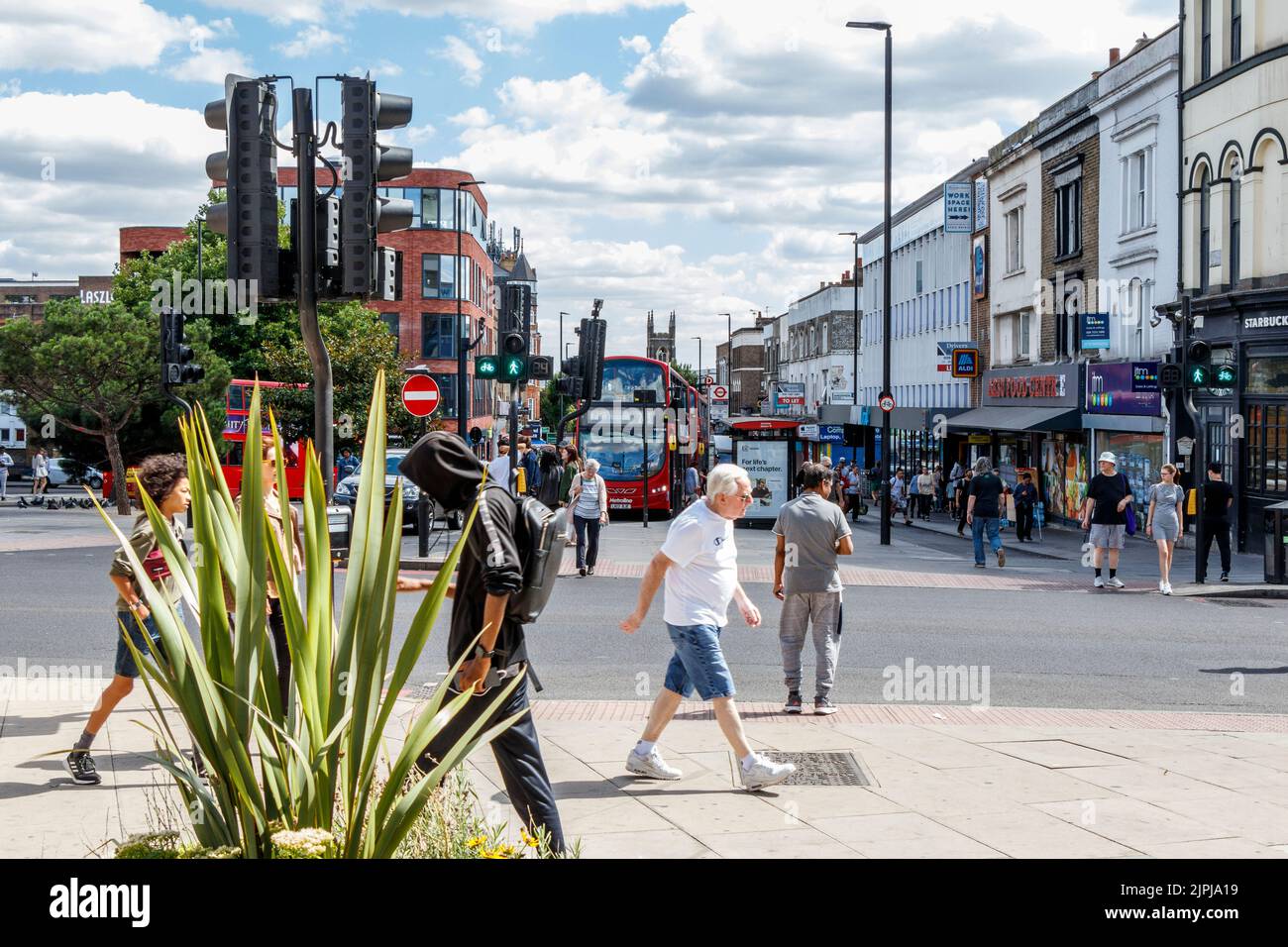 People walking past the pedestrianised area of Navigator Square ...