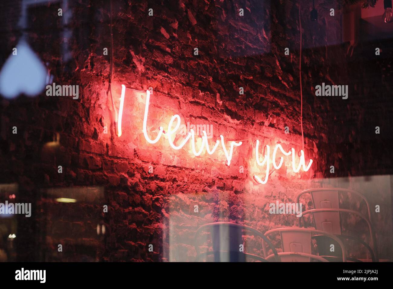A led light I Leuv You message on a stone wall, play on words Stock ...