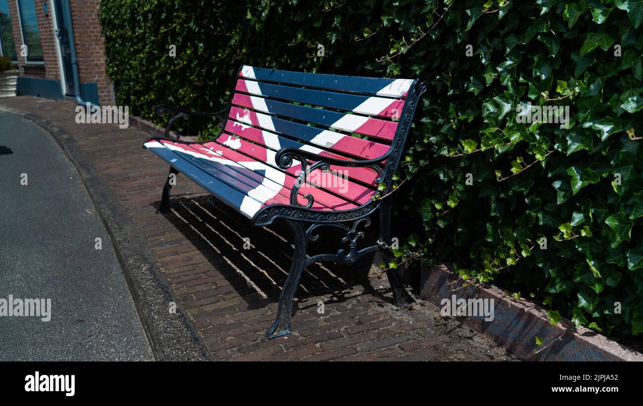 A bench painted in flag of Seychelles Stock Photo - Alamy