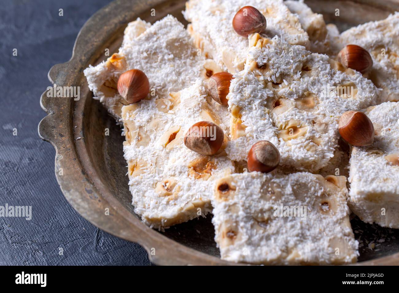 Traditional delicious Turkish dessert; cezerye with hazelnuts and ...