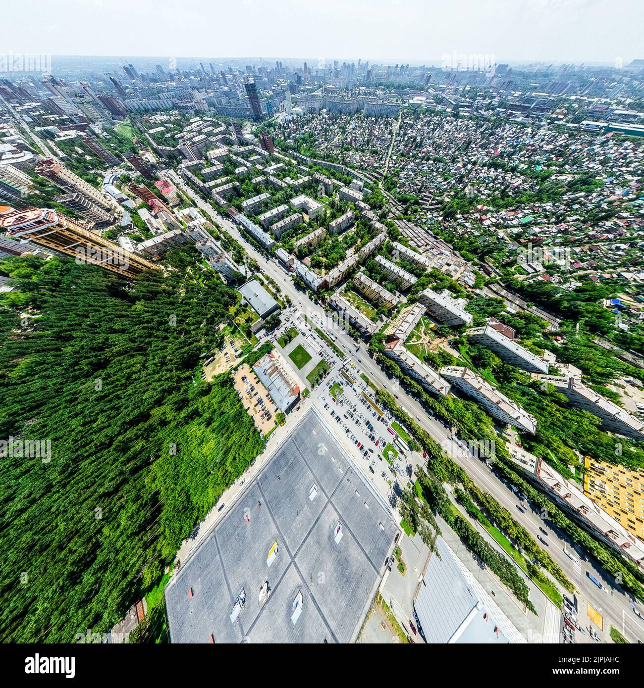 Aerial city view with crossroads and roads, houses, buildings, parks ...