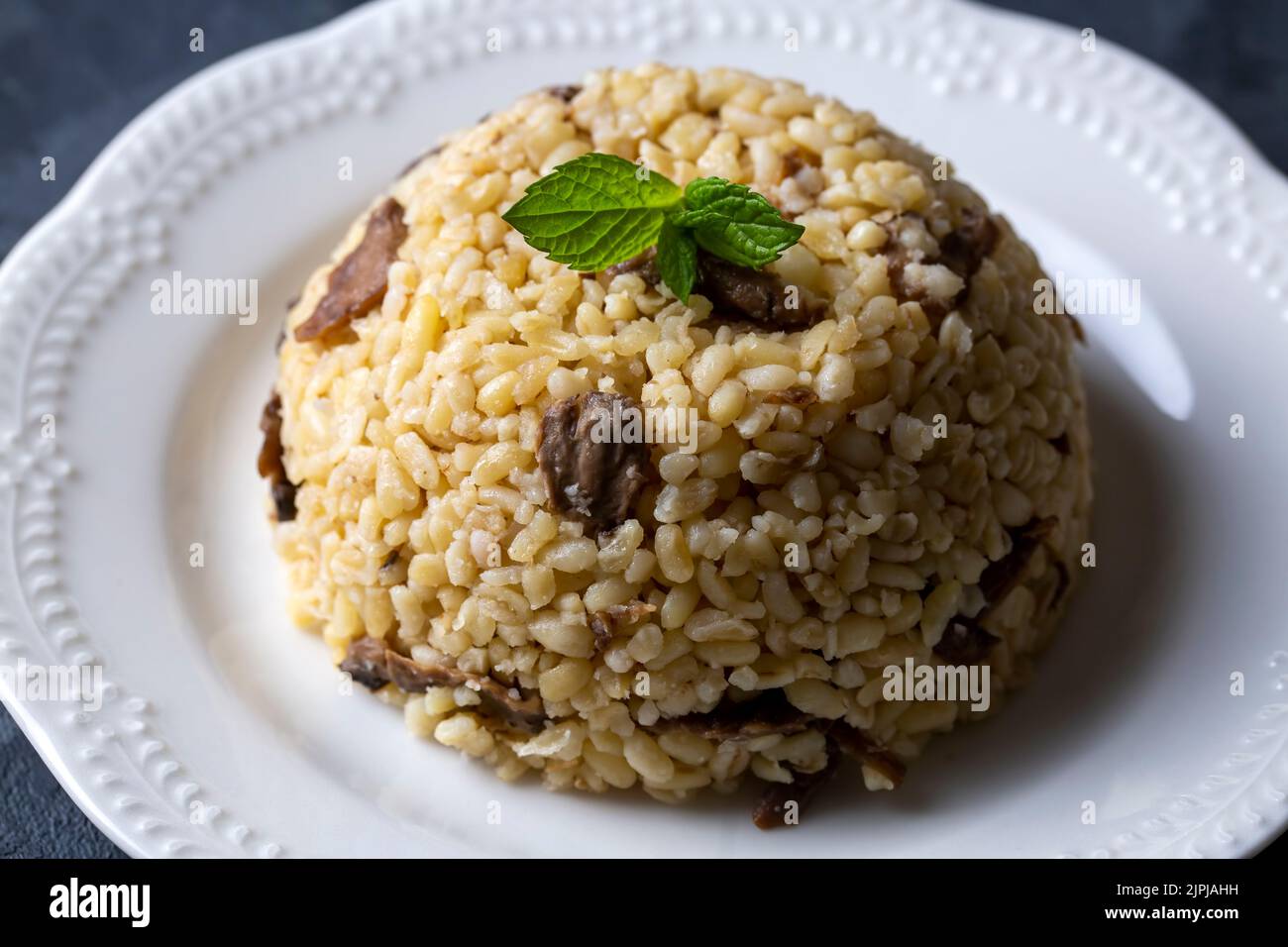 Turkish foods; Bulgur pilaf with mushrooms (Turkish name; mantarli ...