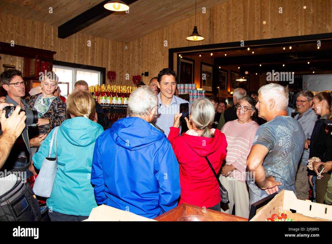 Prime Minister Justin Trudeau, centre, poses for photos as he tours ...