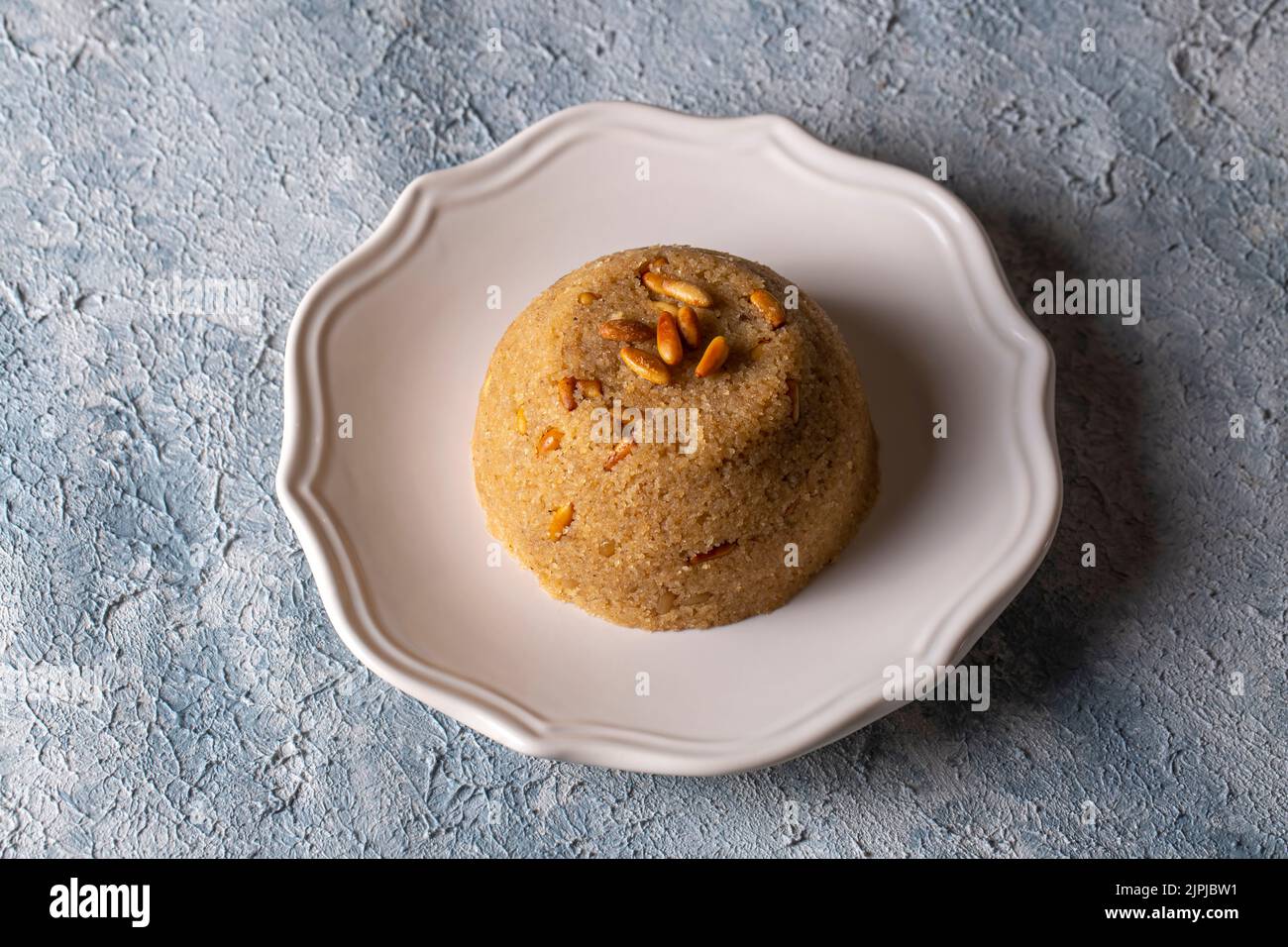 Traditional Turkish desserts; Semolina halva with orange (Turkish name ...