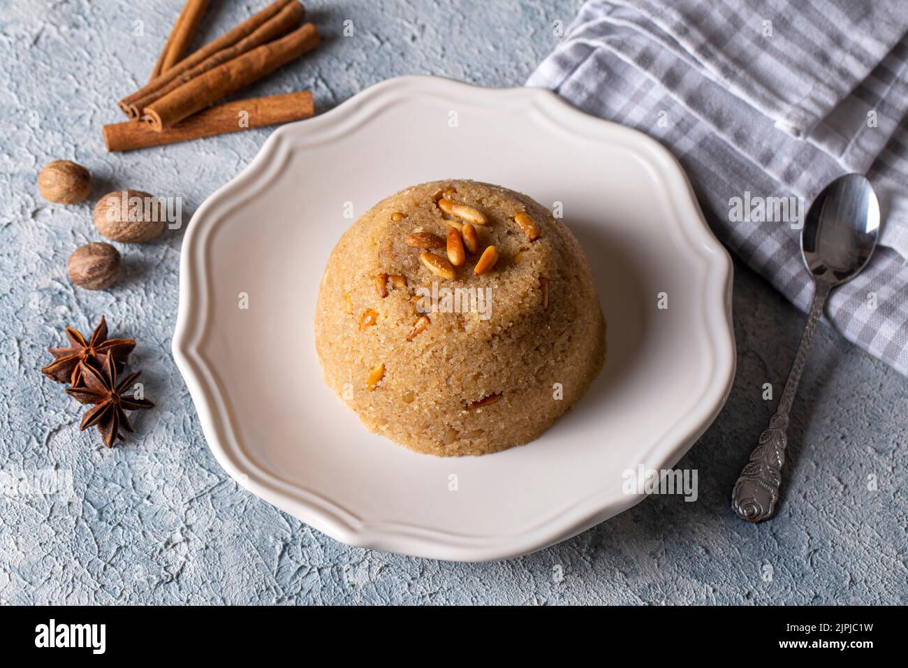Traditional Turkish desserts; Semolina halva with orange (Turkish name ...