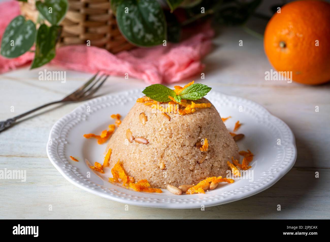 Traditional Turkish desserts; Semolina halva with orange (Turkish name ...