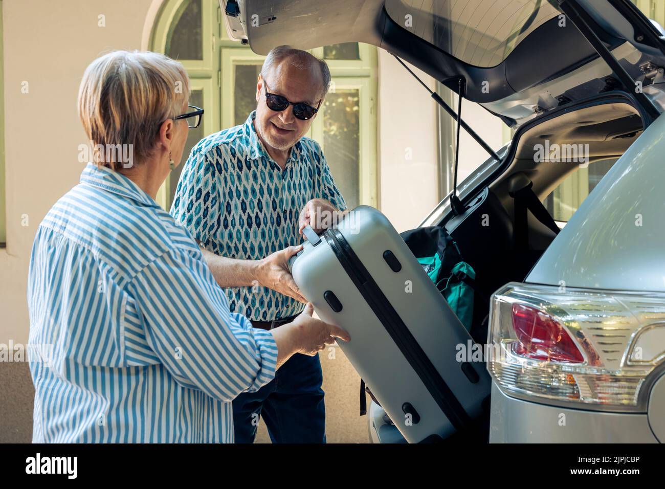 Elderly loading car trunk hi-res stock photography and images - Alamy