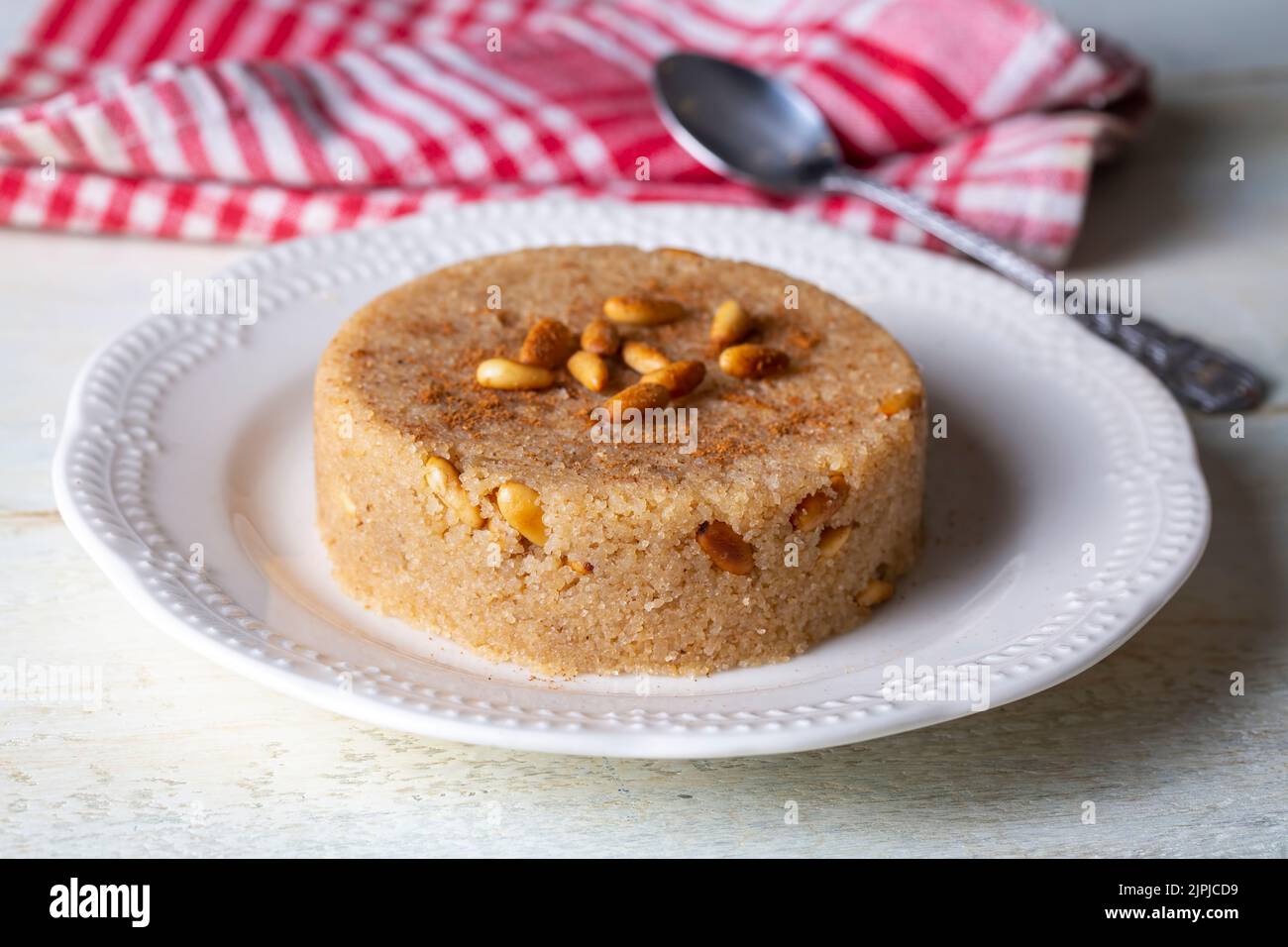 Traditional Turkish desserts; Semolina halva with orange (Turkish name ...