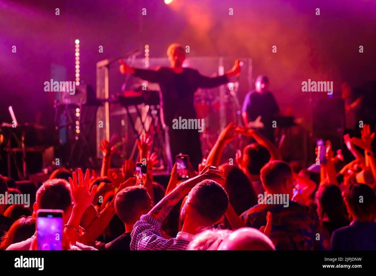 Crowd dancing near stage during concert Stock Photo - Alamy