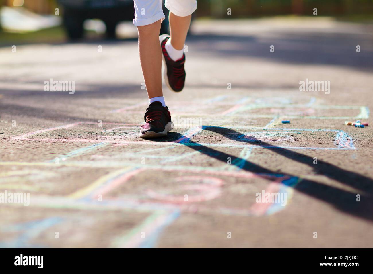Kids play hopscotch in summer park. Healthy active outdoor game ...