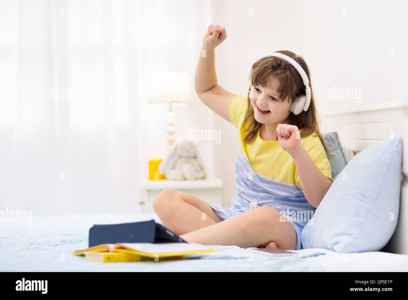 Teenager girl with tablet computer. Teen kid texting and playing online ...