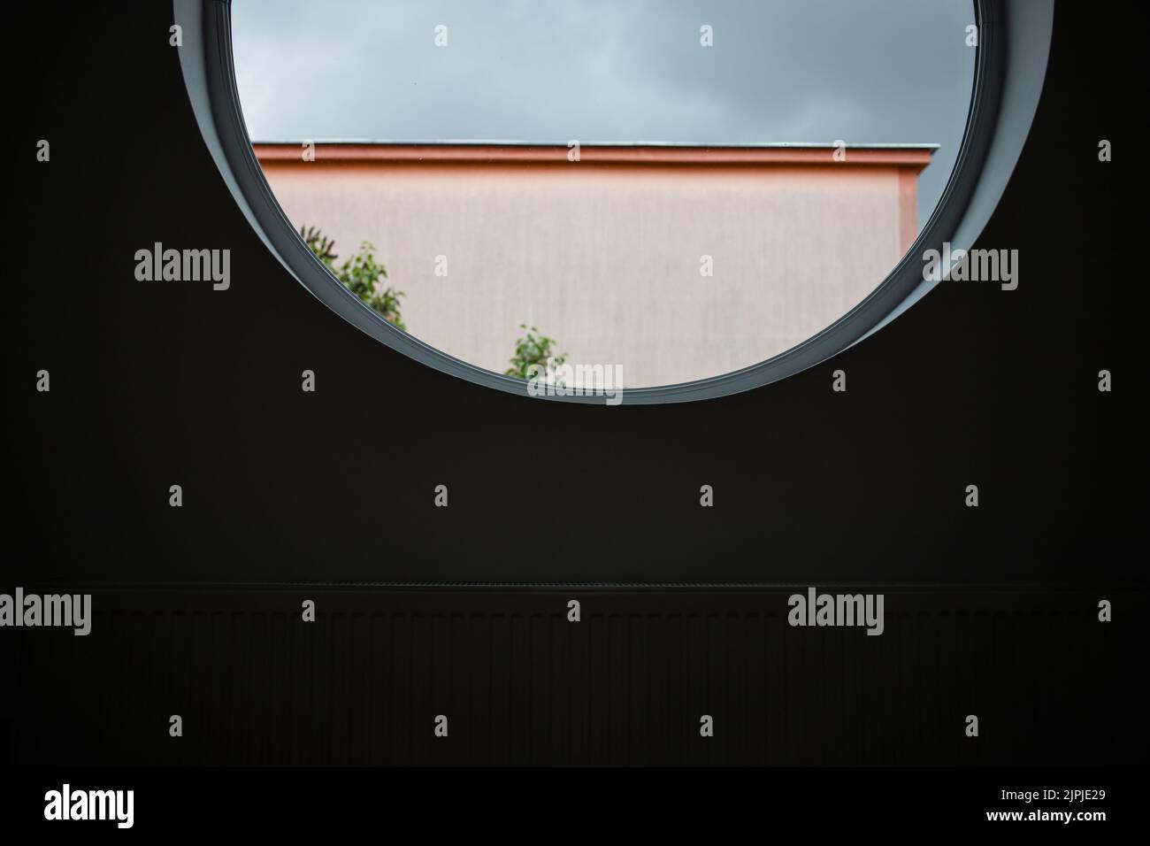 round window tree and house Stock Photo - Alamy