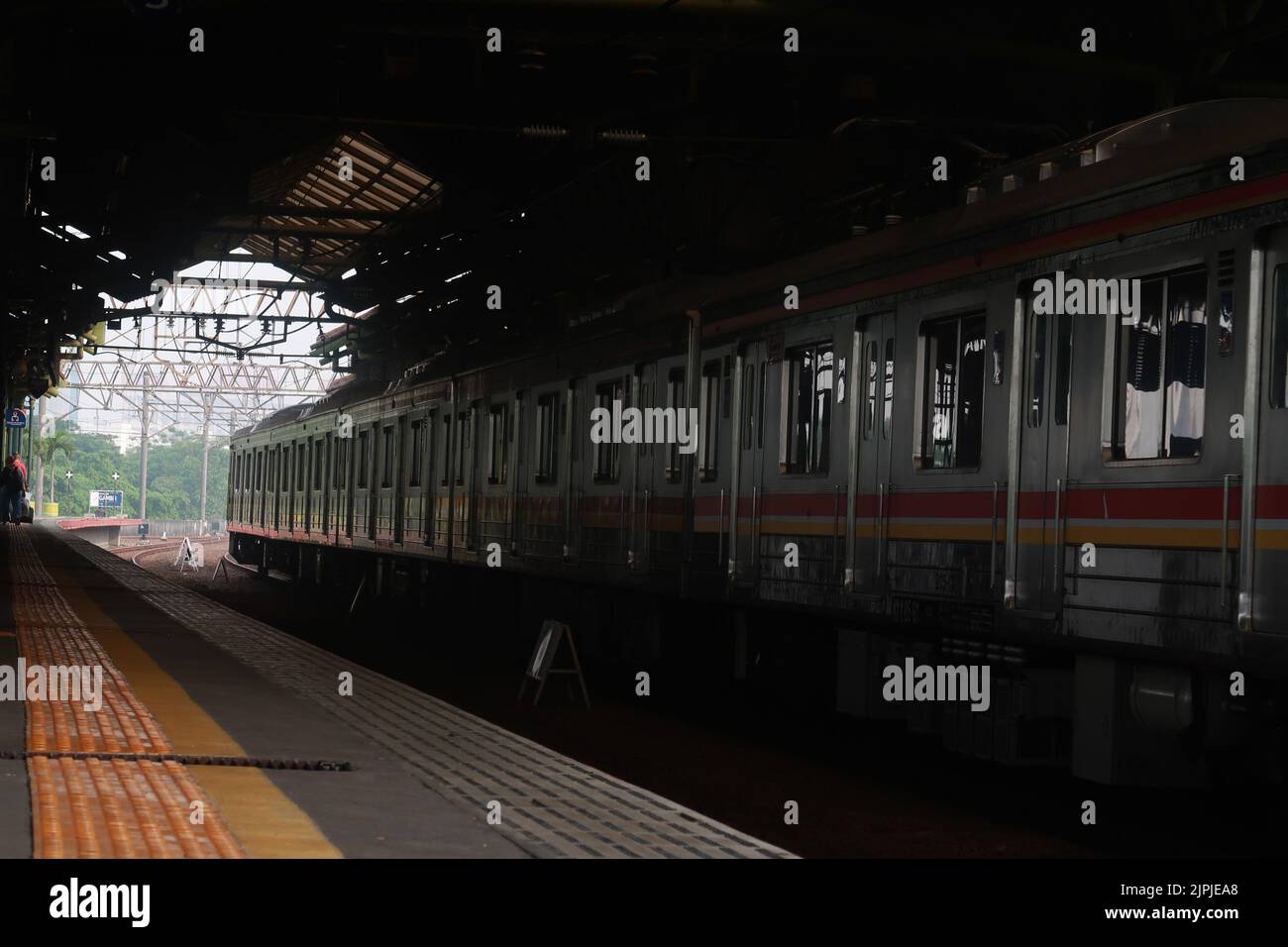 Indonesian Commuter Trains passing through the Gambir Train Station ...