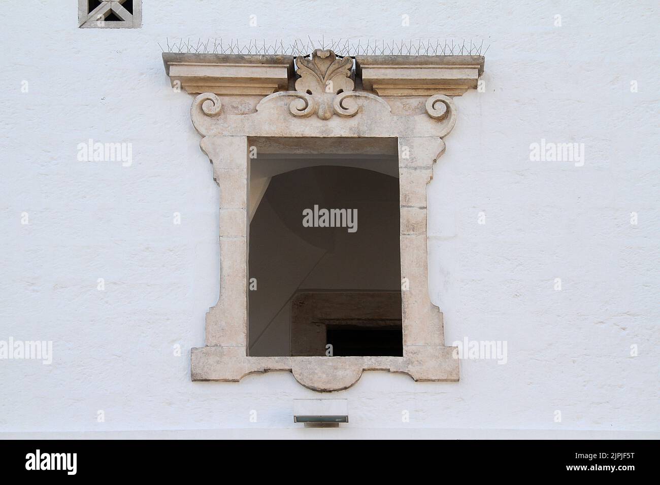 Beautiful architectural design around window in Carovigno, Italy. Anti ...