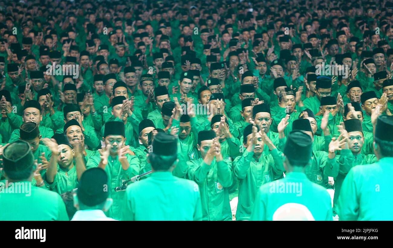 Mass dance and chanting of prayers accompanied by tambourine music from ...