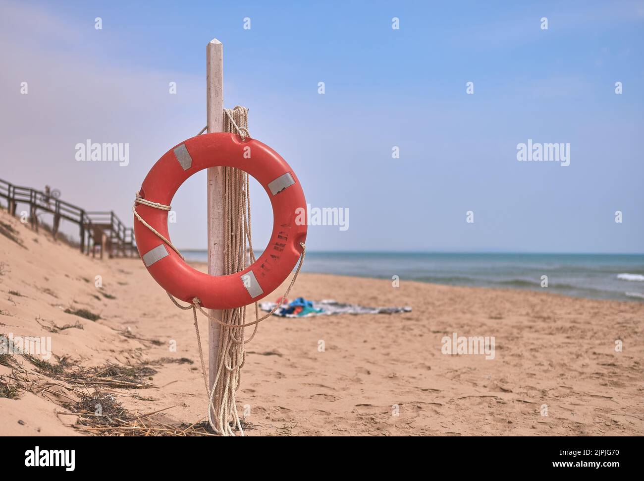 detail of a float or lifebuoy on a post on a beach Stock Photo - Alamy