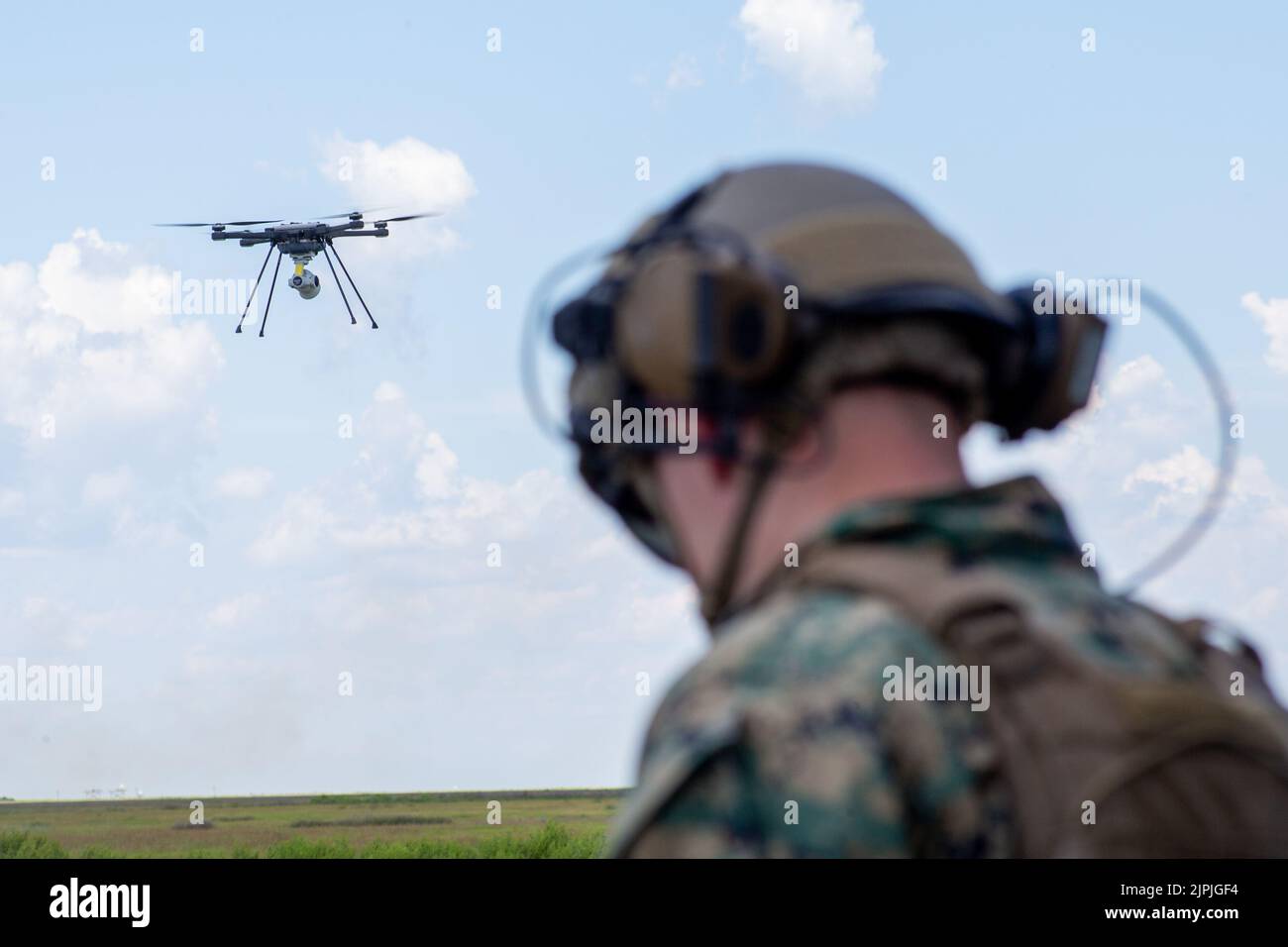 A U.S Marine assigned to II Marine Expeditionary Force watches a R80D ...