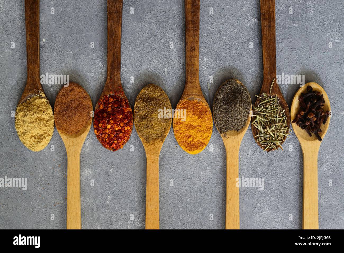 Different kind of spices on a wood background. Big set of Indian spices ...