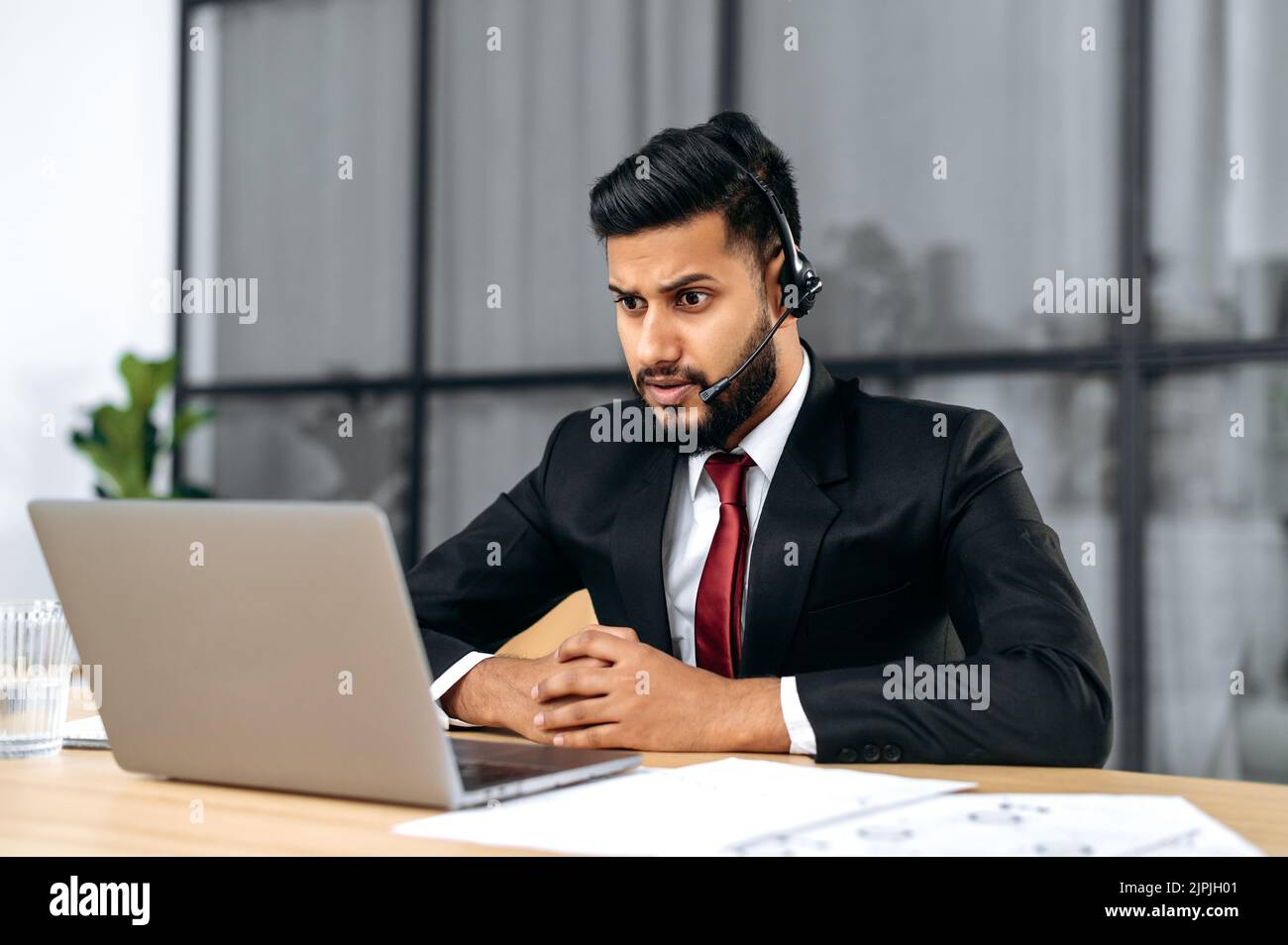 Puzzled stunned indian or arabian young businessman, company ceo, with ...