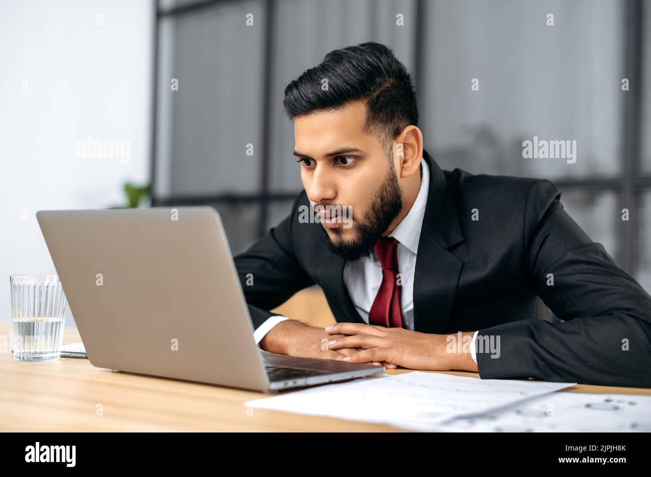 Shocked puzzled stunned indian or arabian young businessman, company ...