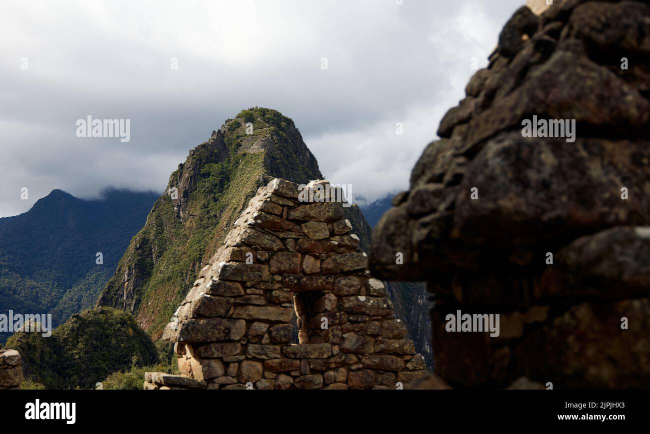 A vertical shot of the famous world wonder Inca ruins of Machu Picchu ...