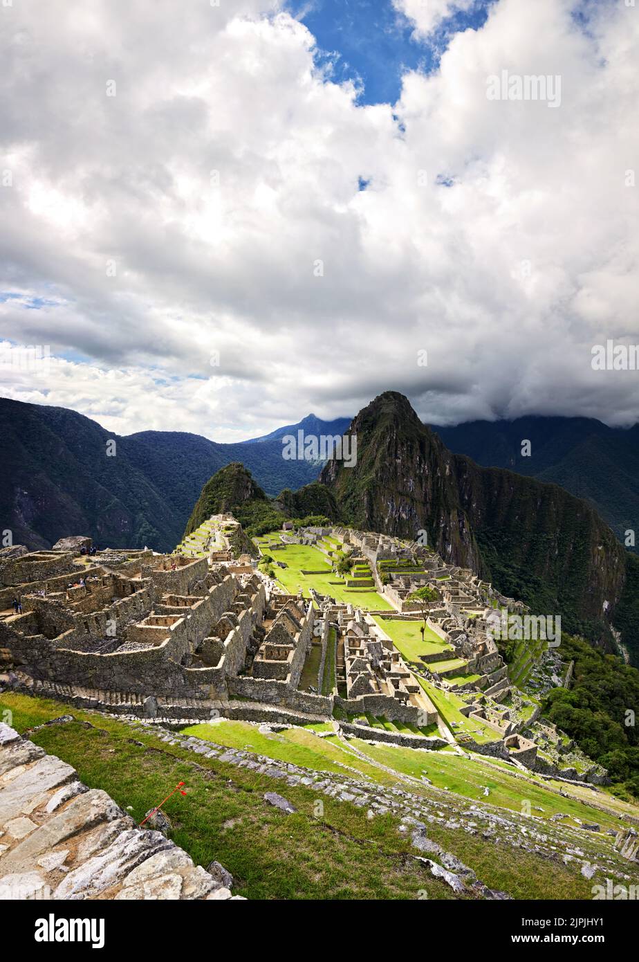 A vertical of the famous world wonder Inca ruins of Machu Picchu with ...
