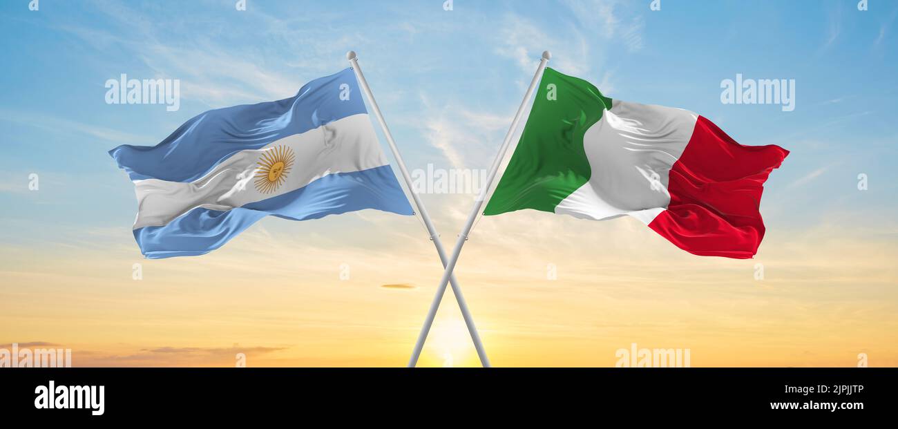 crossed national flags of Argentine and Italy flag waving in wind at ...