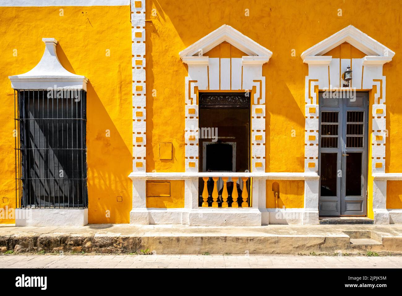 Typical old yellow house at the magical town of Izamal in Yucatan Stock ...
