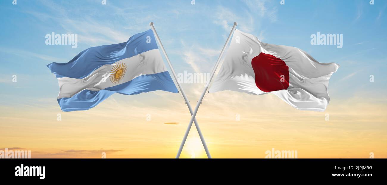 crossed national flags of Argentine and japan flag waving in wind at ...