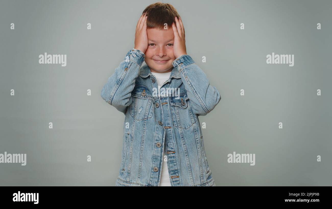 Sincere toddler children boy in jacket wishing, waiting for good luck ...