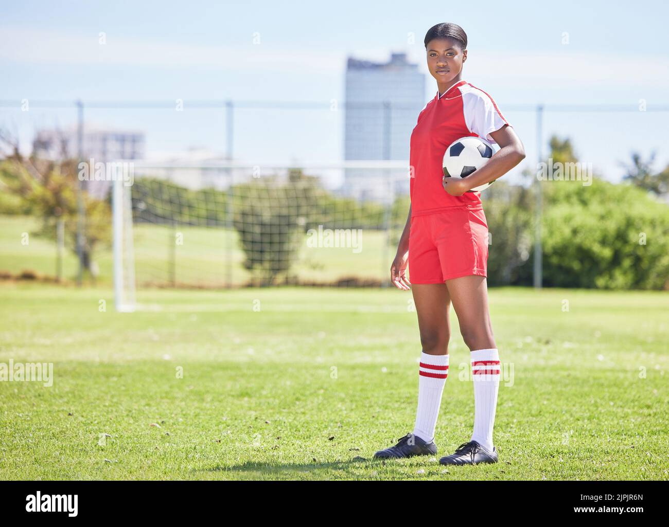 Sports, woman athlete and soccer player training at stadium grass ...