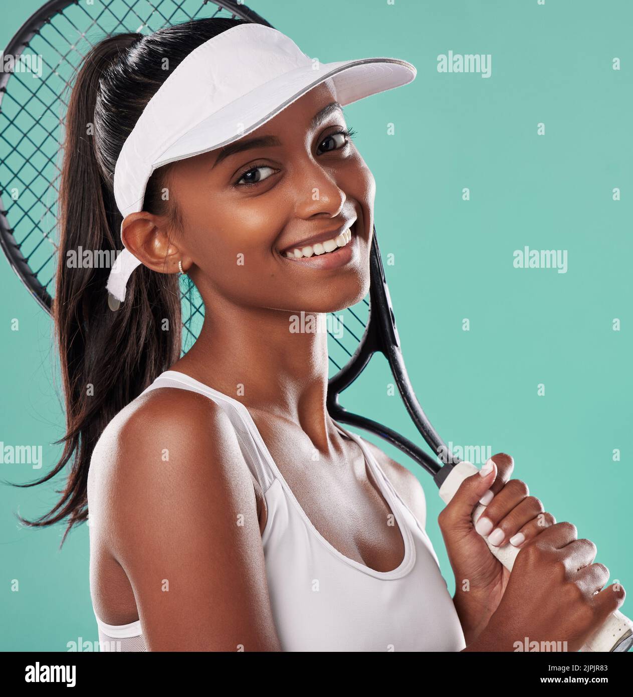 Fit, athlete or female tennis player holding a racket smiling and ready ...