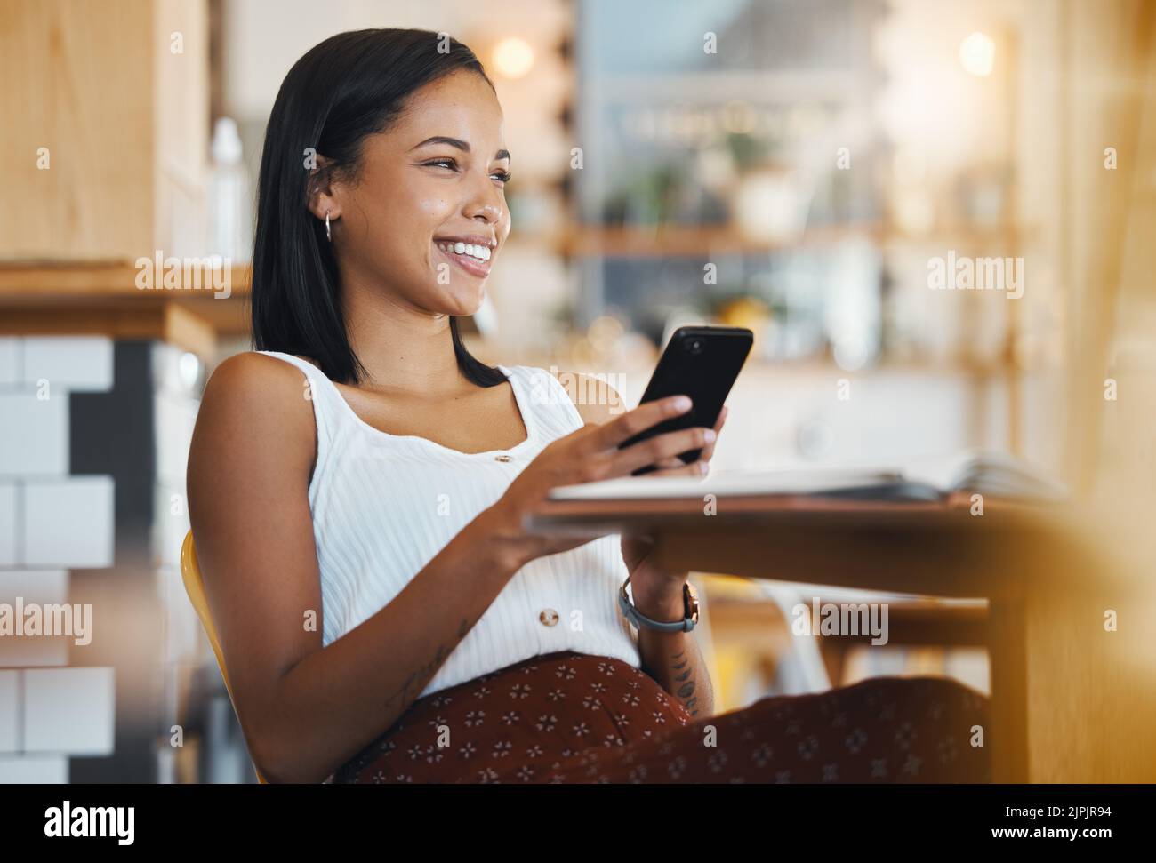 Relaxing, texting a message or browsing social media on a phone by a ...