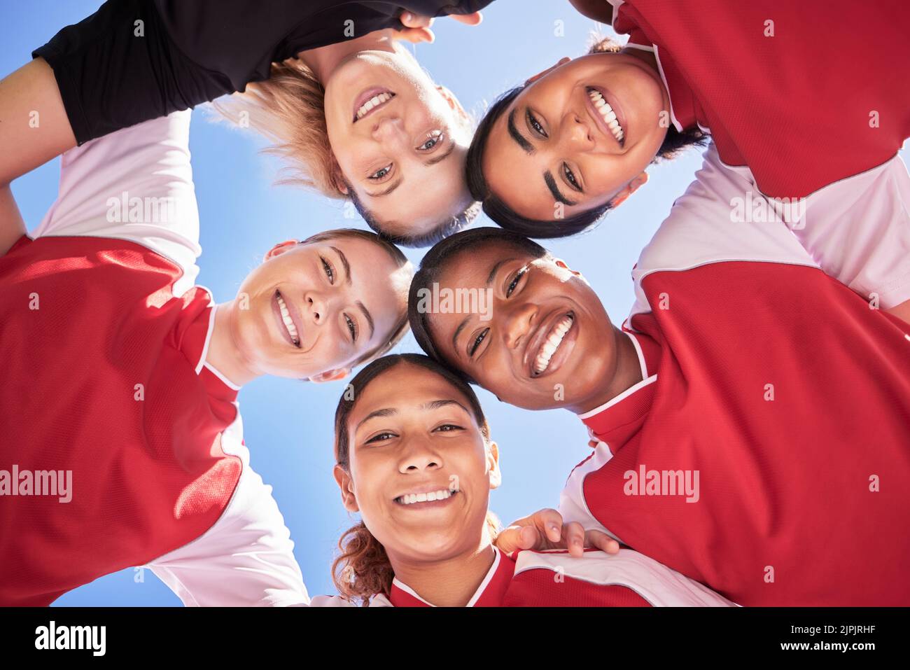 Female soccer team huddle bonding, smiling or motivated in circle with ...