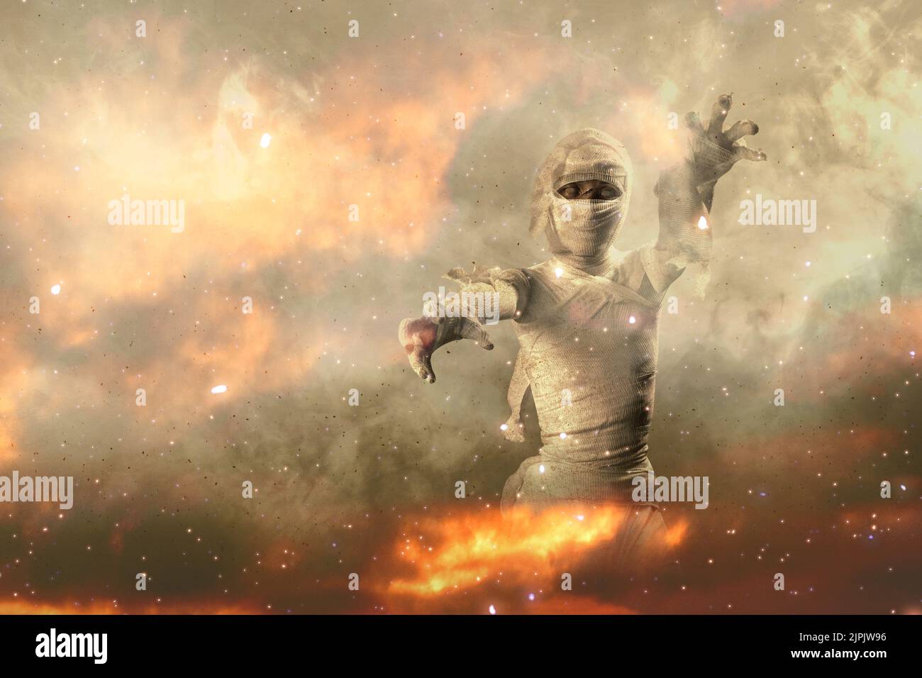 Mummy standing with claw hands with a fire background. Halloween ...