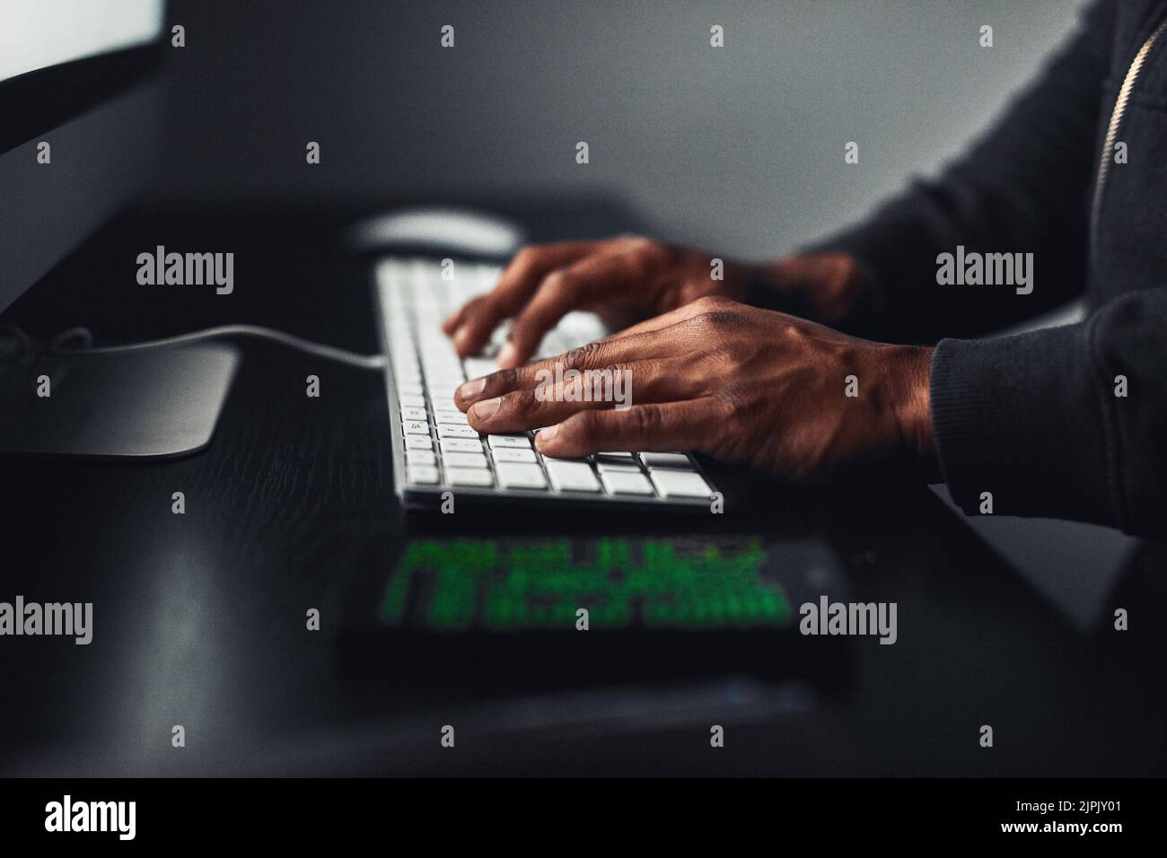 Your data is always at risk. an unrecognisable hacker using a computer ...