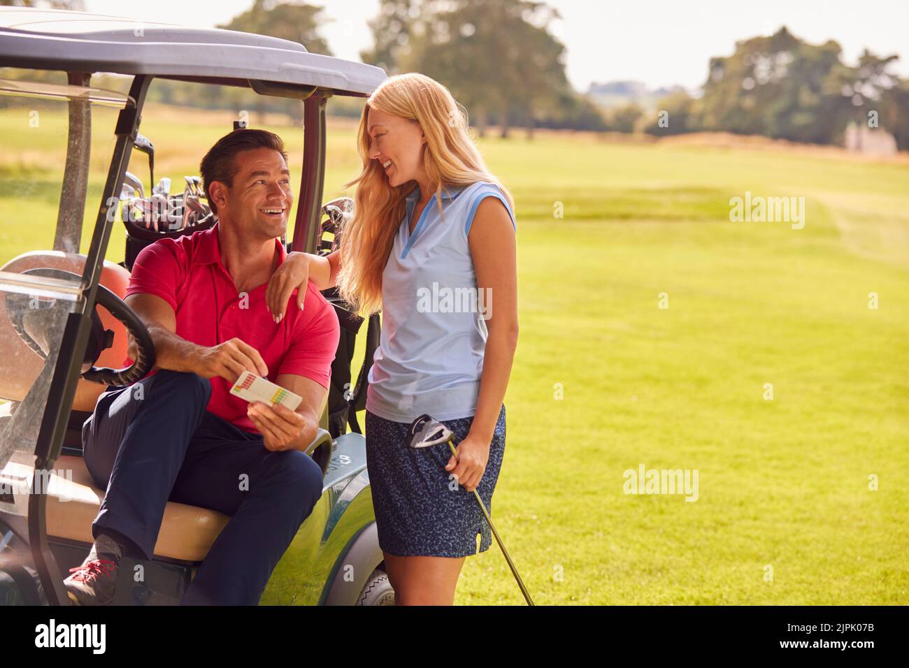 Smiling male female golf hi-res stock photography and images - Alamy