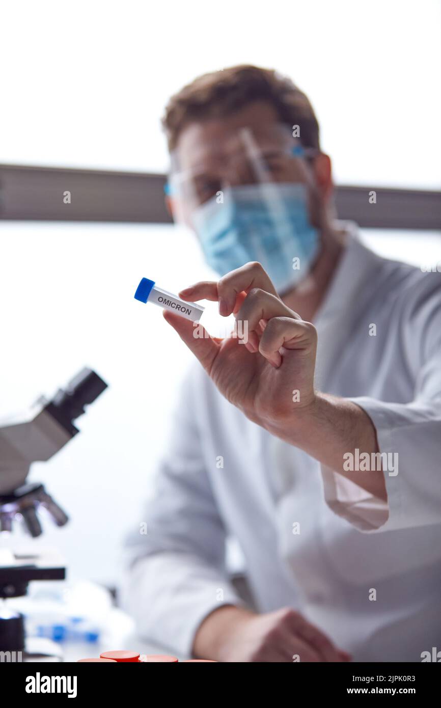 Examining laboratory assistant corona hi-res stock photography and ...