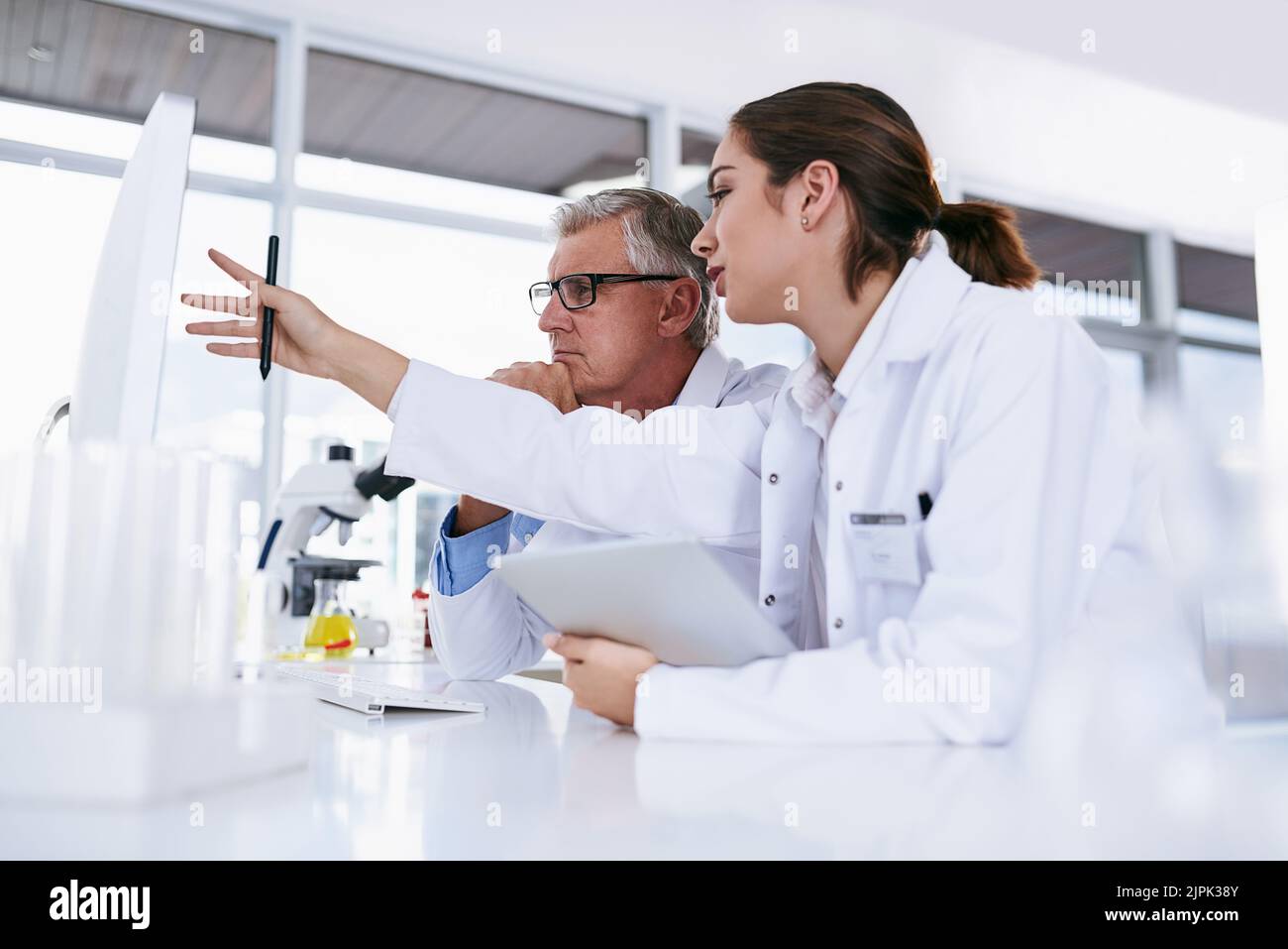 Running through their latest findings. two scientists working together ...