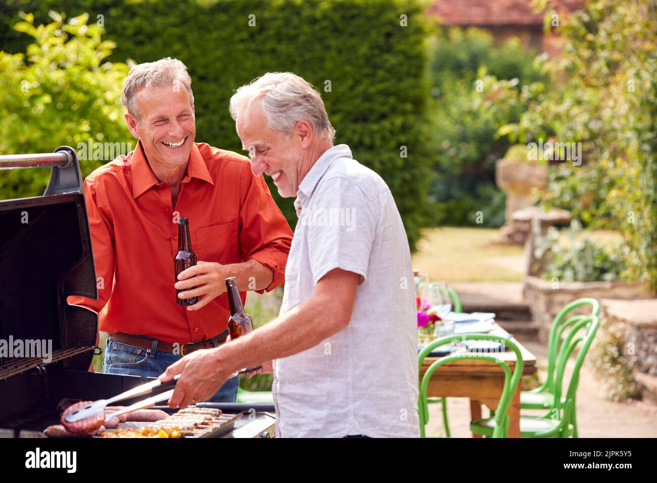 Older men barbecue beer hi-res stock photography and images - Alamy