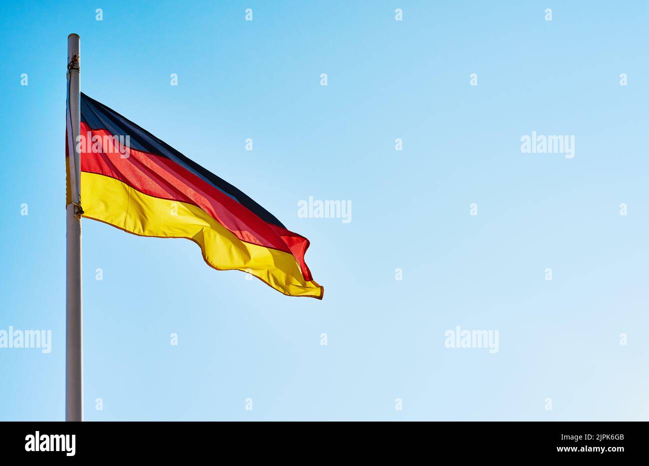 Wunderbar. Low angle shot of the German flag standing on its own ...