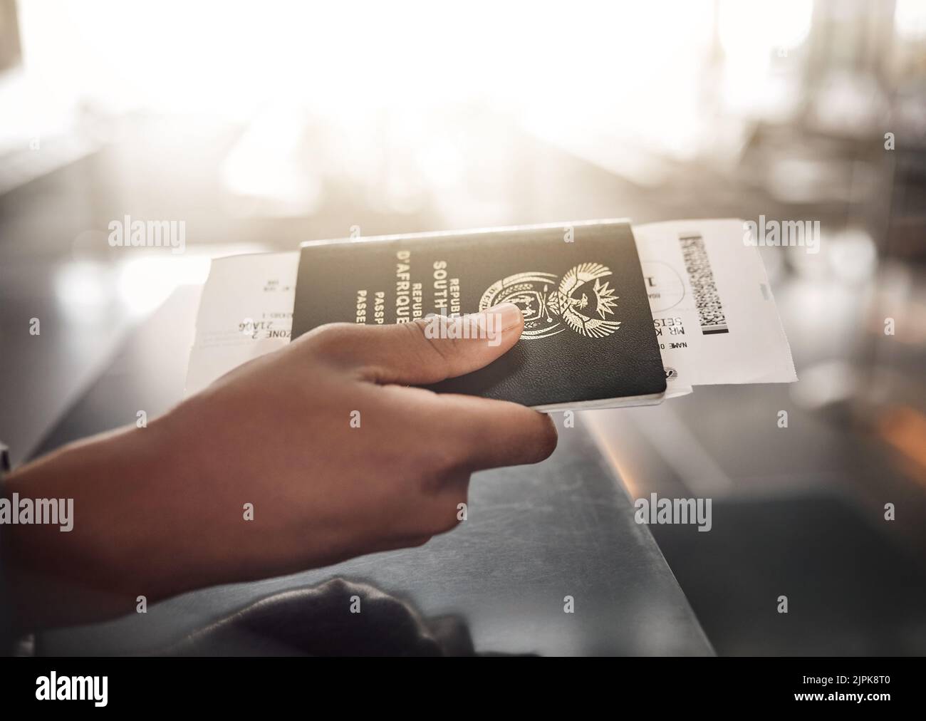 Hes almost on his way. an unrecognizable man handing over his ID book ...